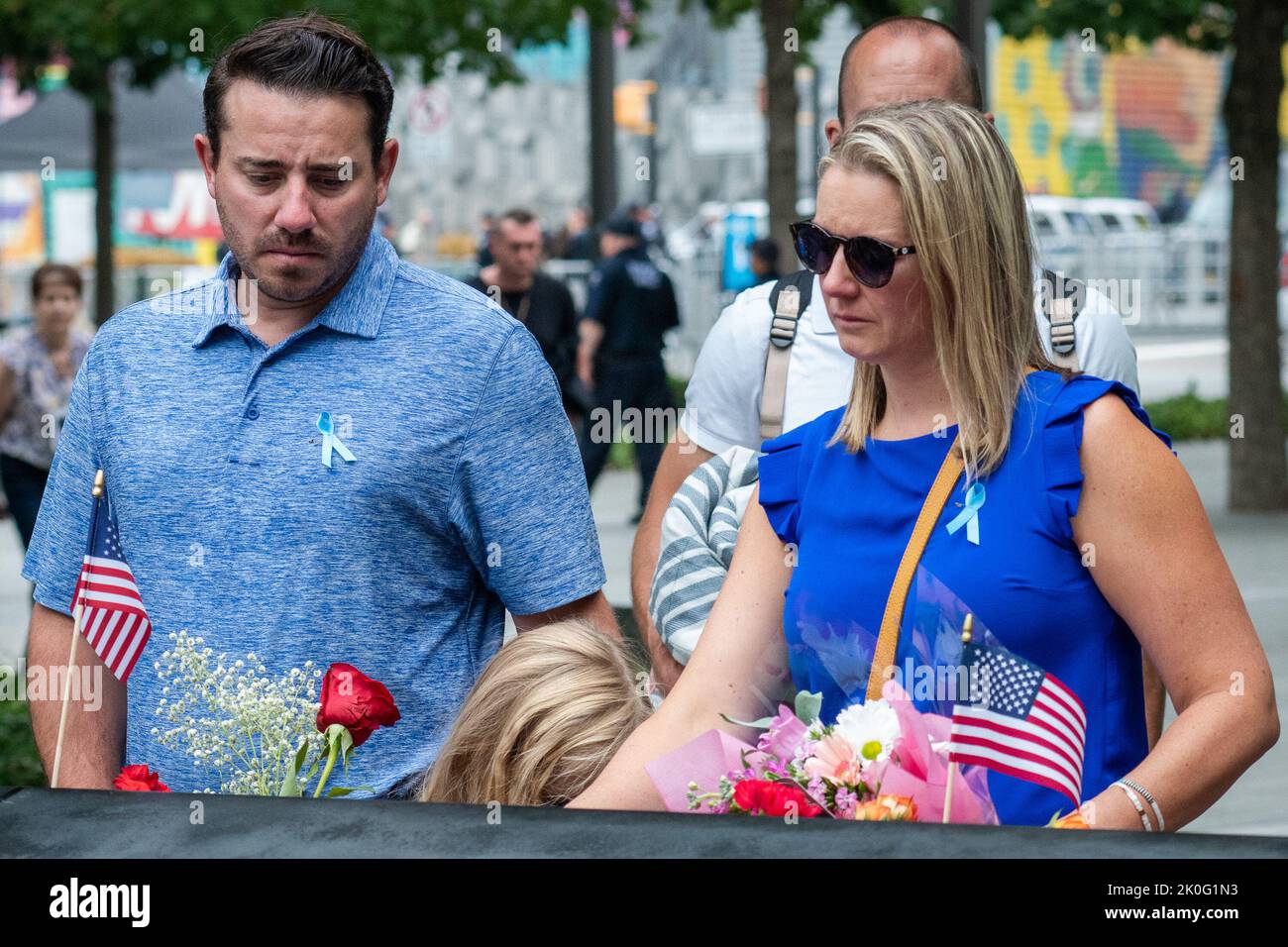 Family members place flowers at the reflecting pool during the 9/11 ...