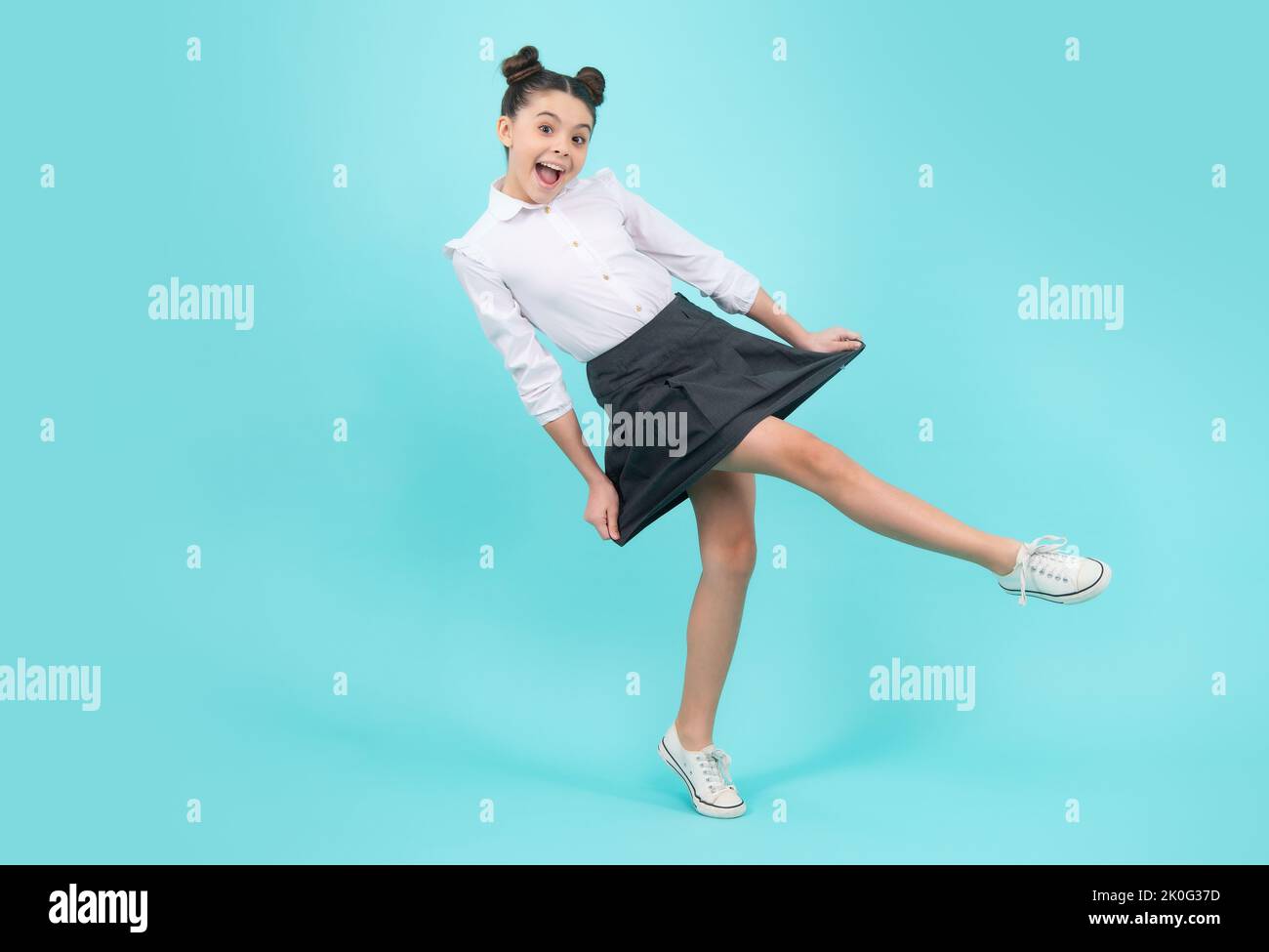 Amazed teenager. Excited teen girl. Full size length of young brunette ...