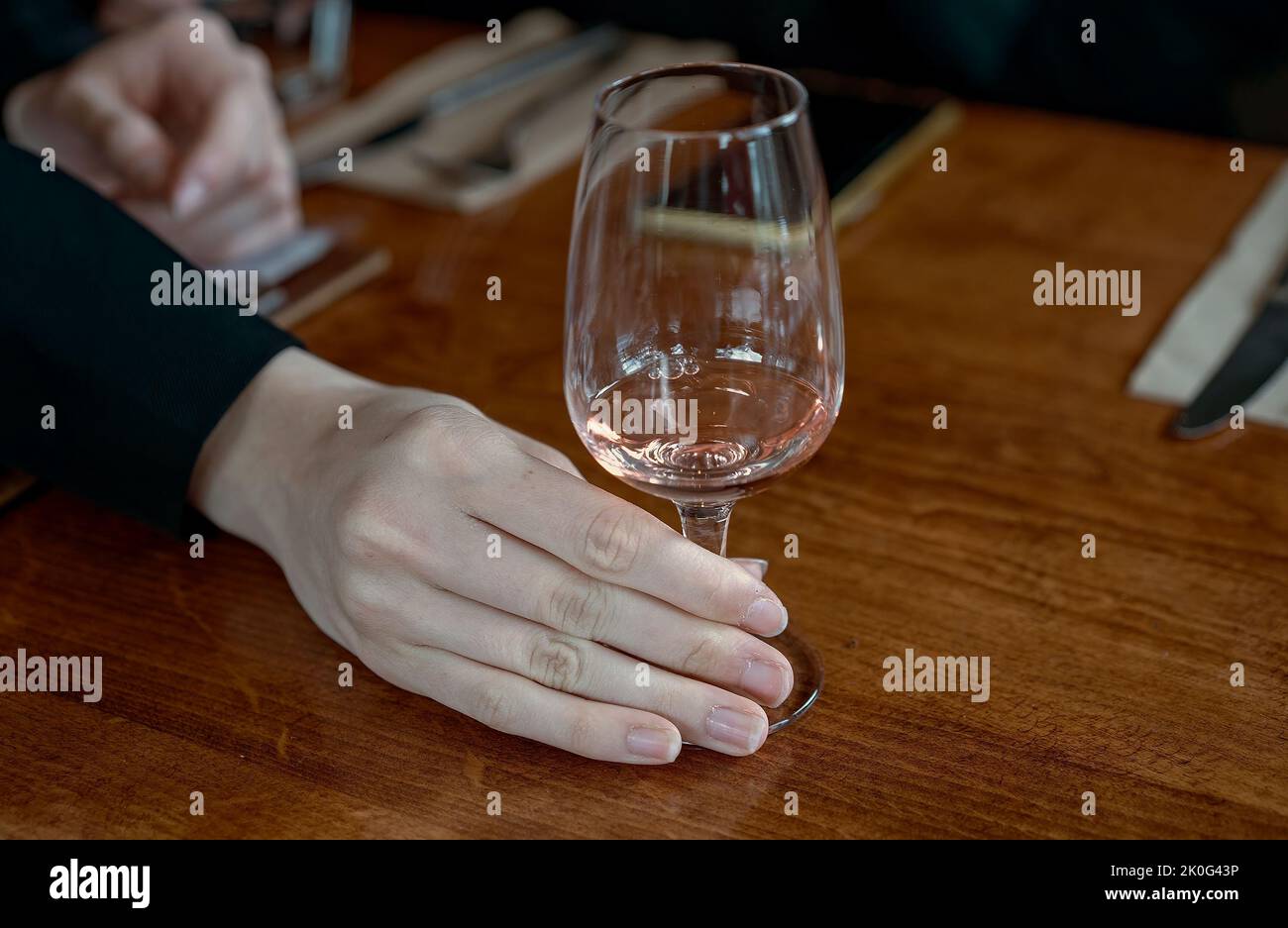 Hand reaching glass wine hi-res stock photography and images - Alamy