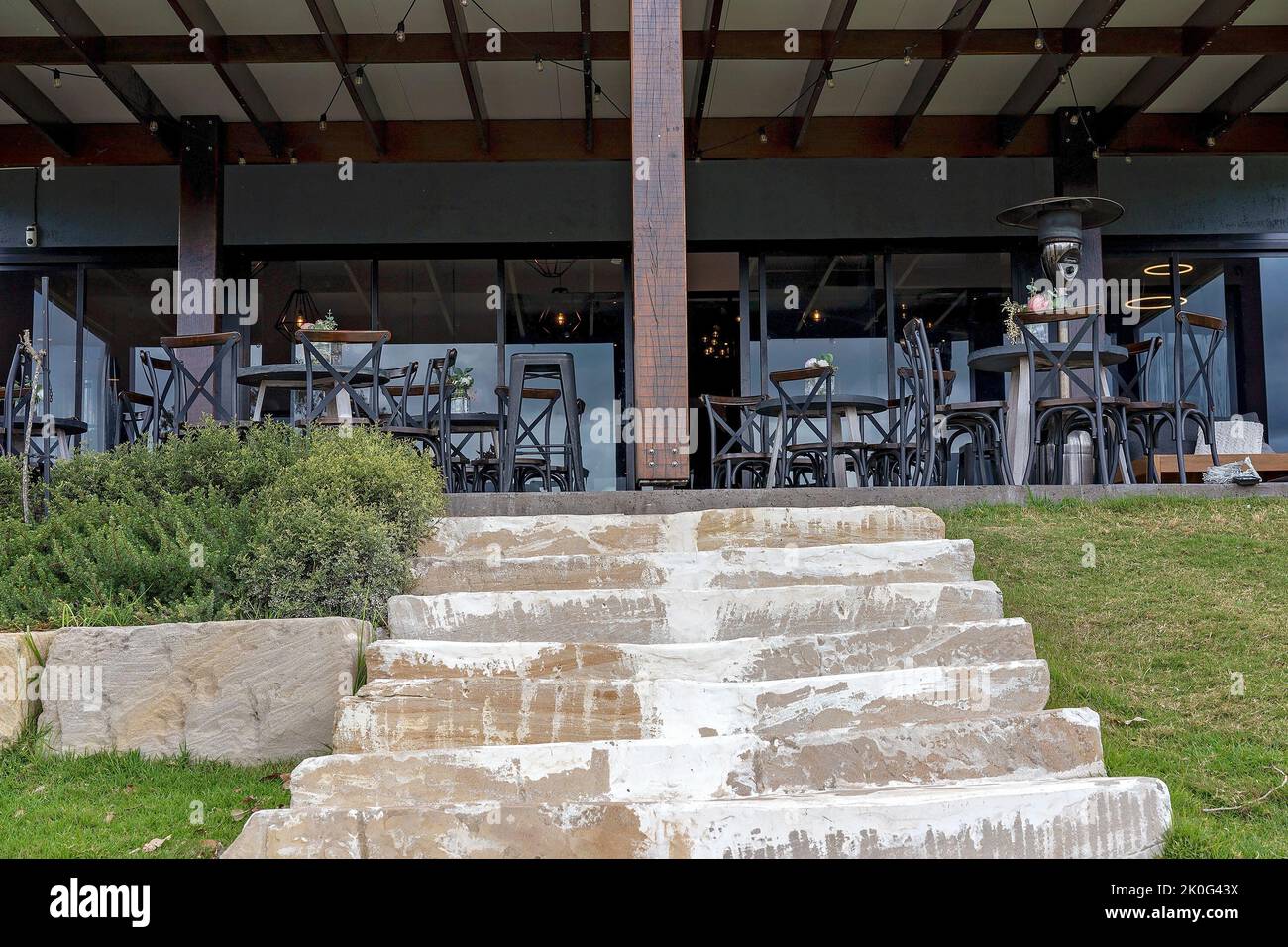 Exterior of a vineyard restaurant with stone steps leading up to the ...