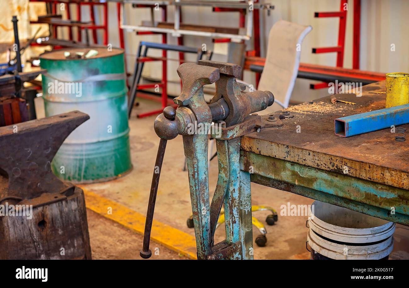 Leg vice metal tool and work bench in a men's recreational shed group ...