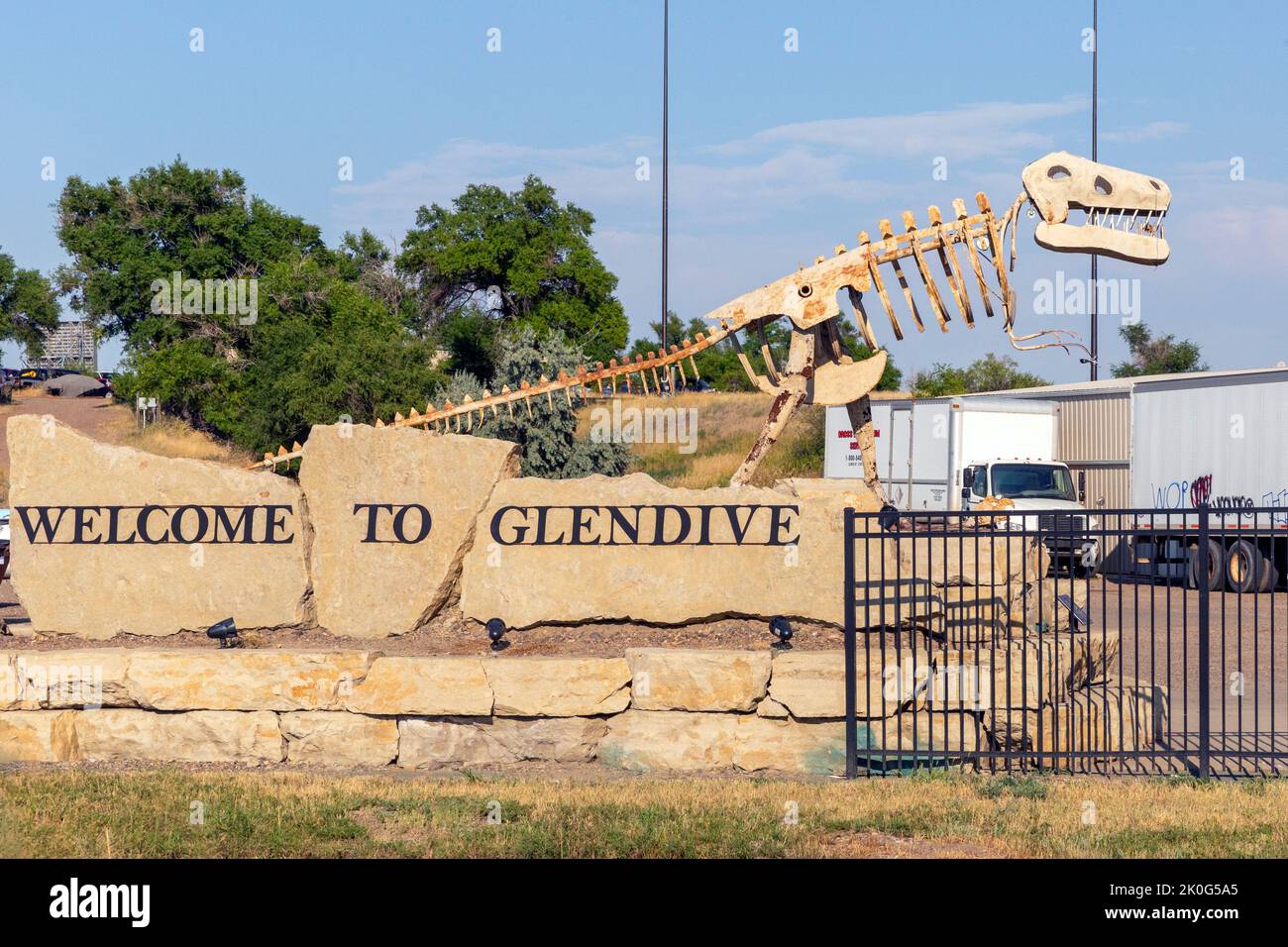 Roadside Welcome to Glendive sign with metal sculpture of a dinosaur in ...