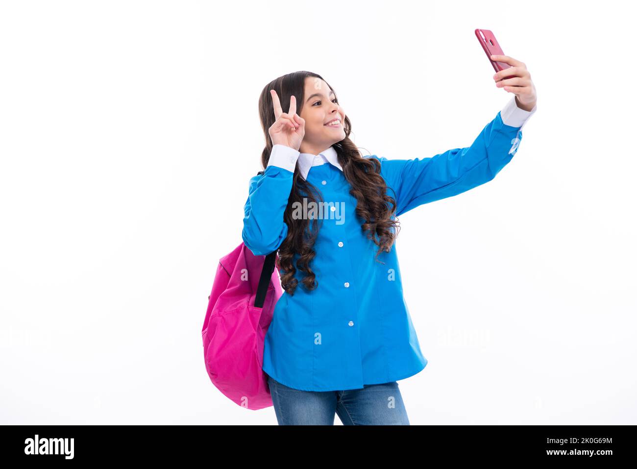 Teen school student girl hold backpack use mobile cell phone on white ...