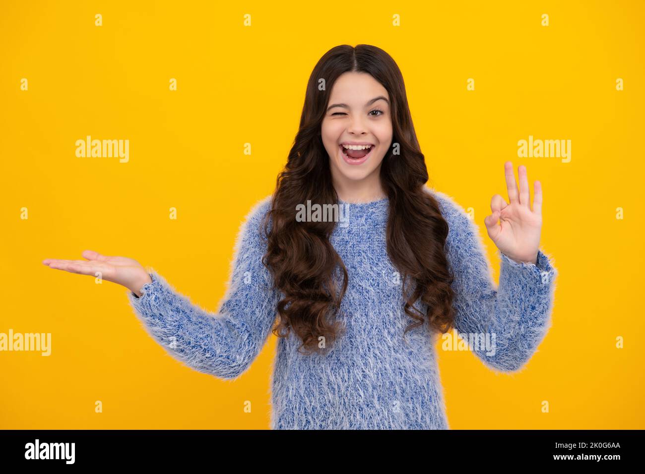 Look at advert. Teenager child points aside shows blank copy space for ...