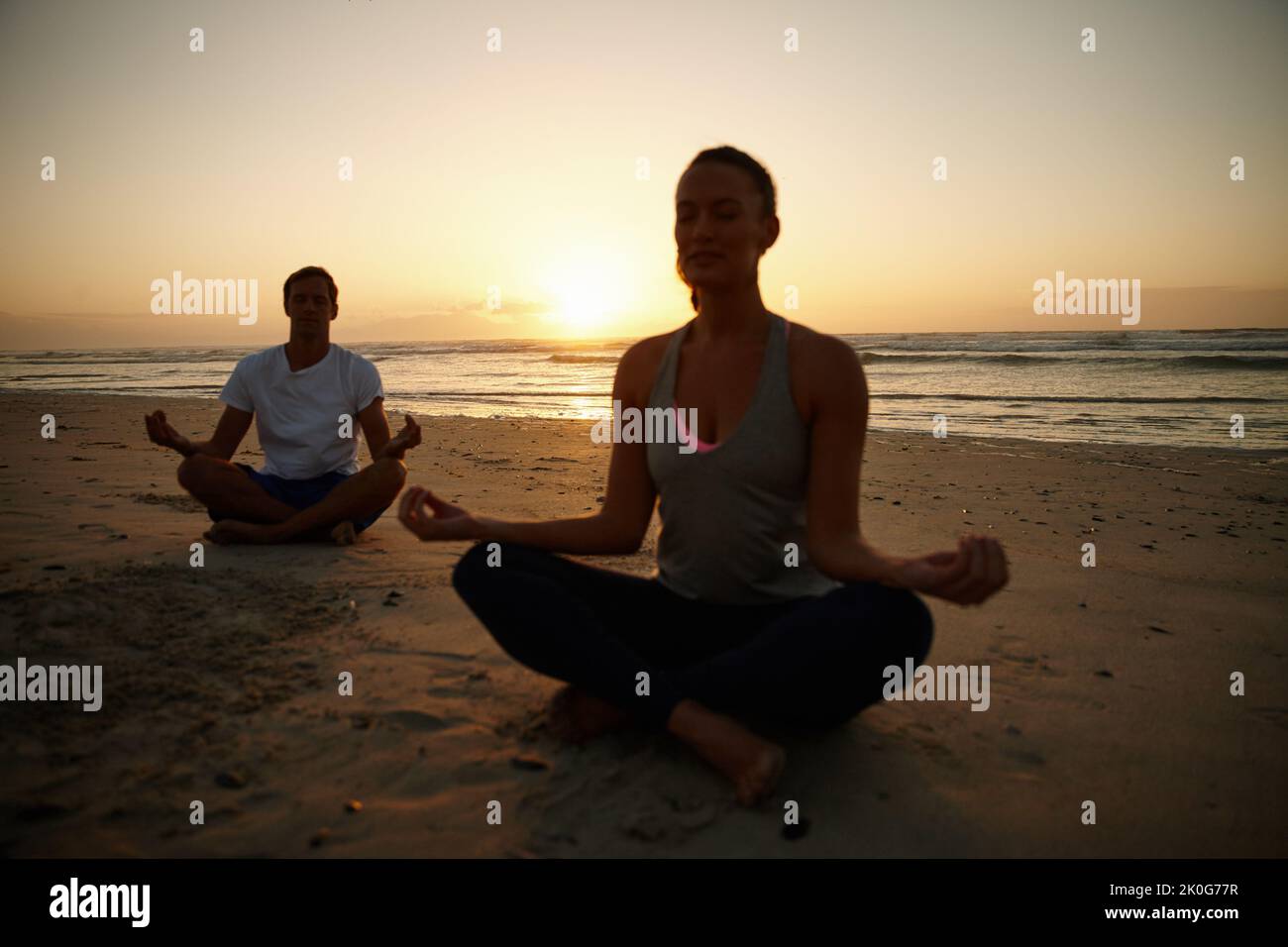 Couple meditating hi-res stock photography and images - Alamy