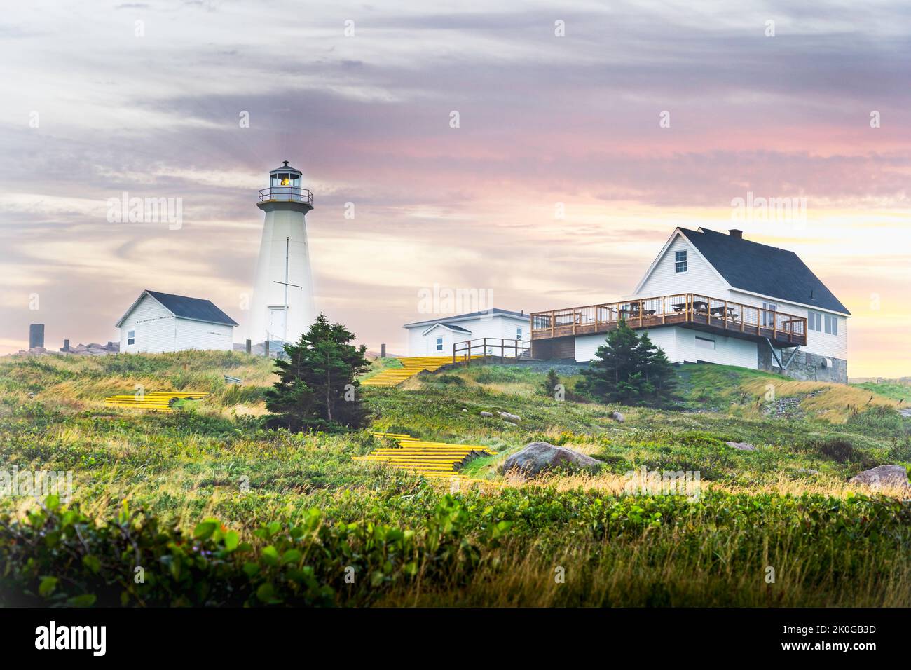 A working lighthouse at Cape Spear during sunset along the East Coast ...