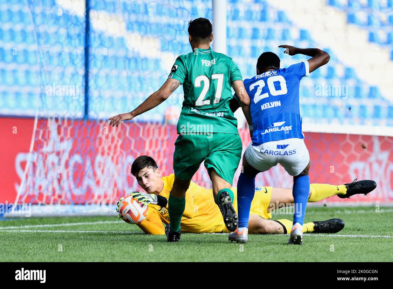 Jong Genk's Mike Penders, Virton's Matteo Perri and Jong Genk's Kelvin ...