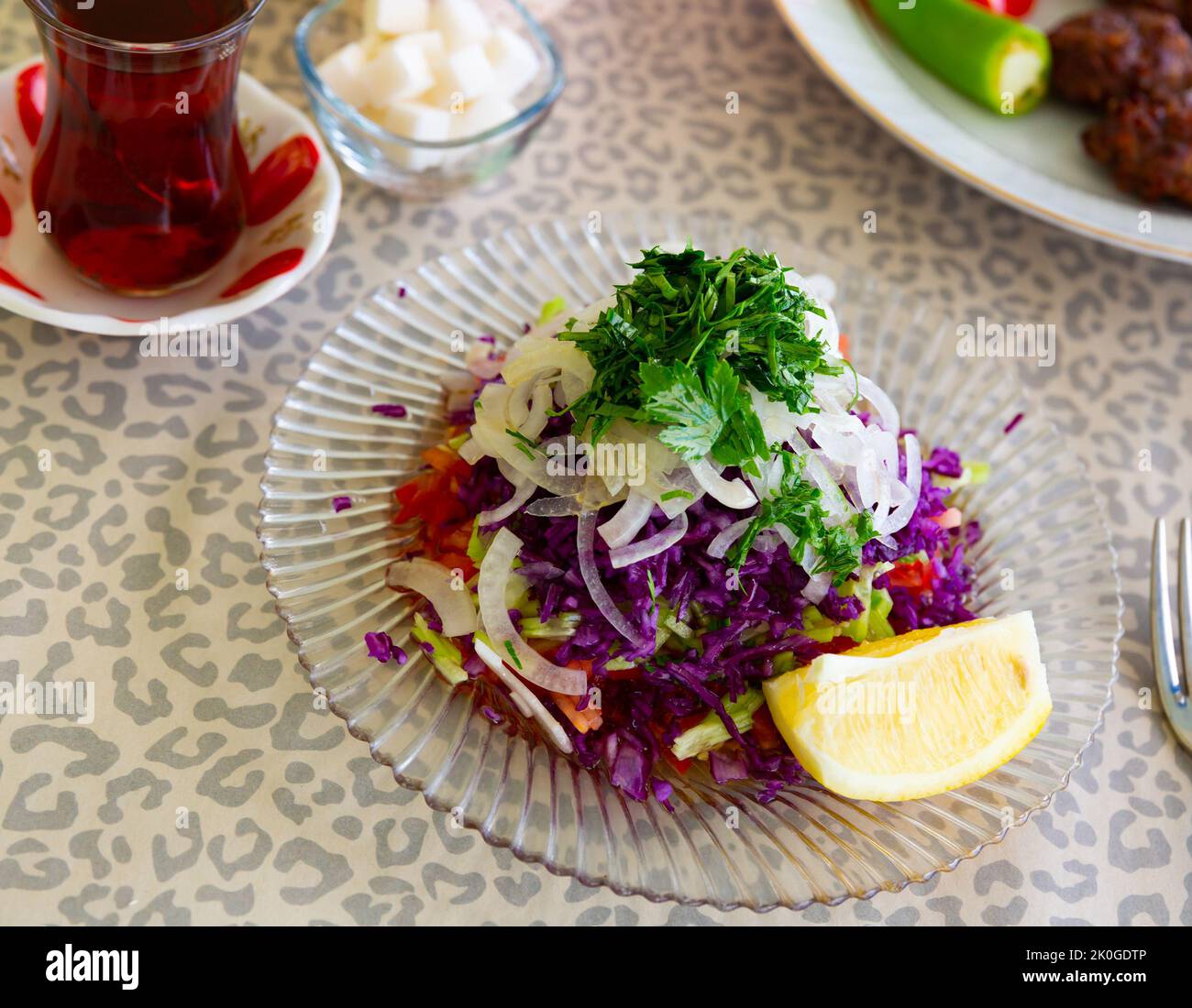 Turkish salad from red cabbages, cucumbers, tomatoes and onion with ...