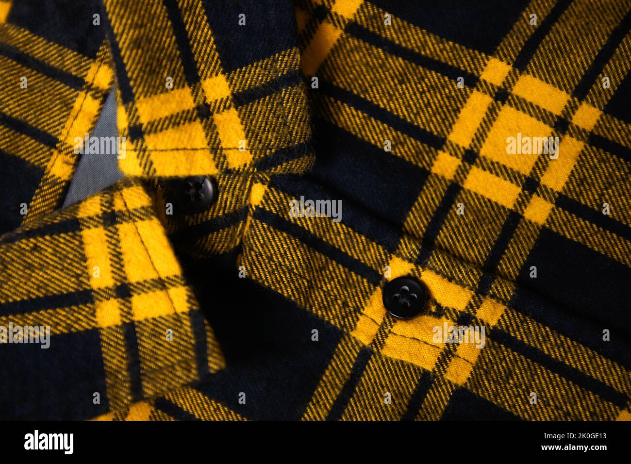 Defocus black and yellow checkered shirt. Gingham tablecloth back ...