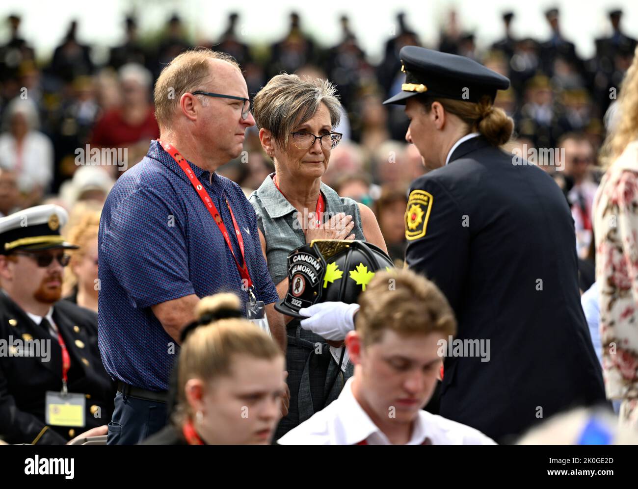 Ray and Brenda Renaud receive the helmet of Firefighter Marc Renaud of ...