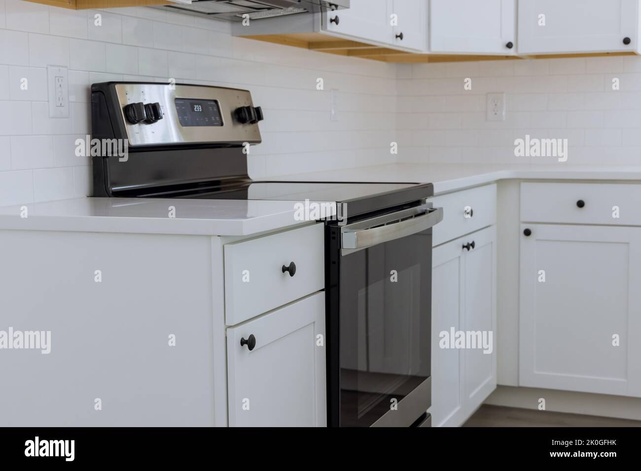 Installing kitchen appliances in a new home as well kitchen cabinets in ...