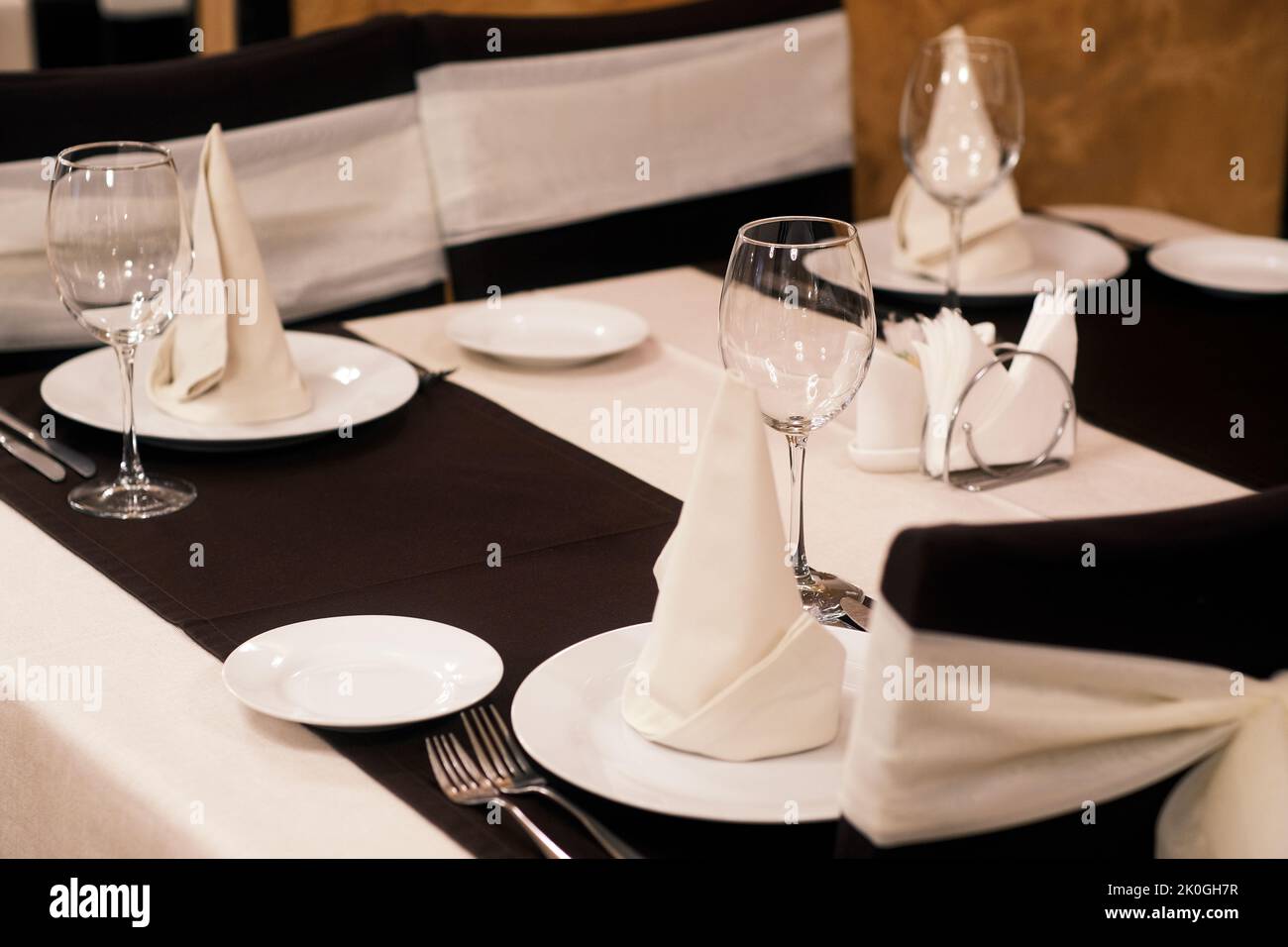 Banquet table with wineglasses. High angle of elegant banquet table served for wedding ...