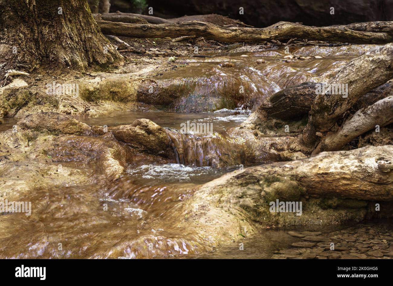 Picturesque fast flowing rocky stream with small waterfall cascades in ...