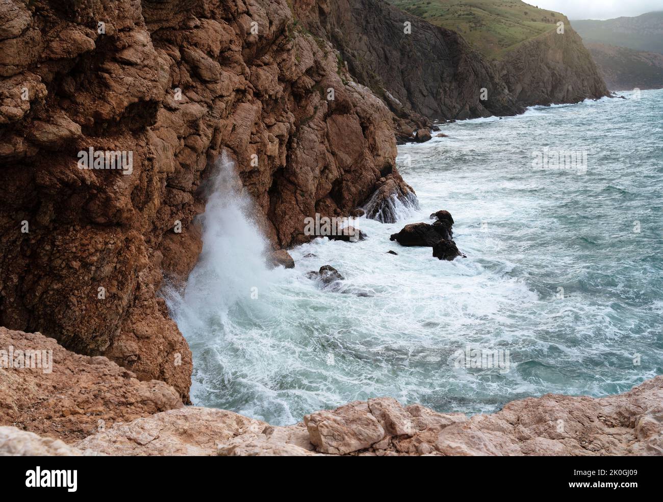 Beautiful seascape with turquoise storming water and high cliffs. Great ...