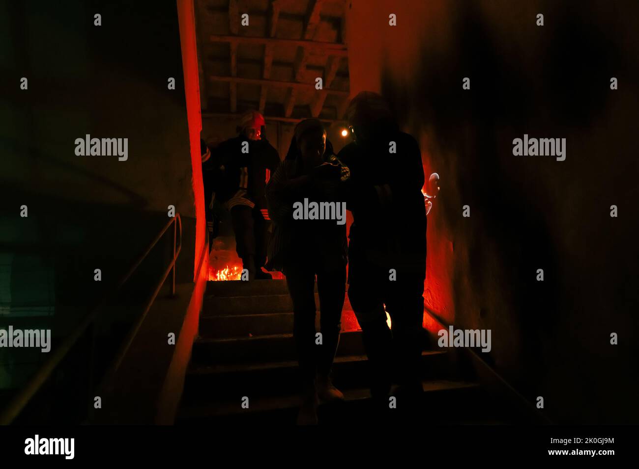 Brave Fireman Descends Stairs of a Burning Building and Holds Saved ...