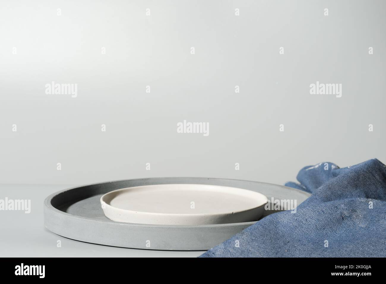 front view of classic minimal table set of two empty plates for food ...