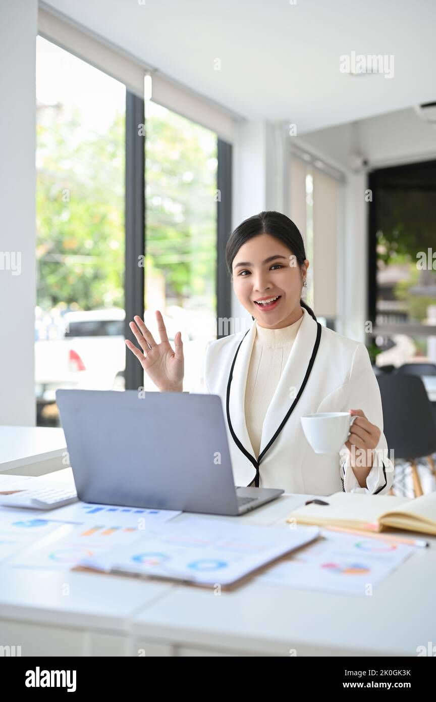 Portrait, Attractive and charming young Asian businesswoman or ...