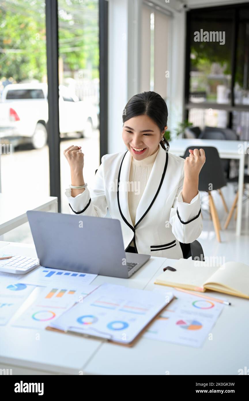 Portrait, Successful Asian businesswoman or female boss celebrating at ...