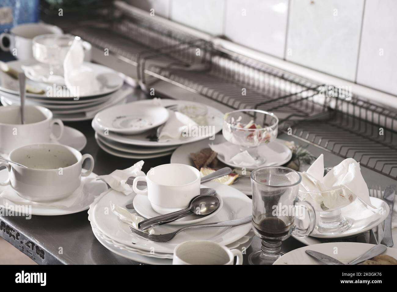 Dirty plates and glasses after a meal in the kitchen in the restaurant ...
