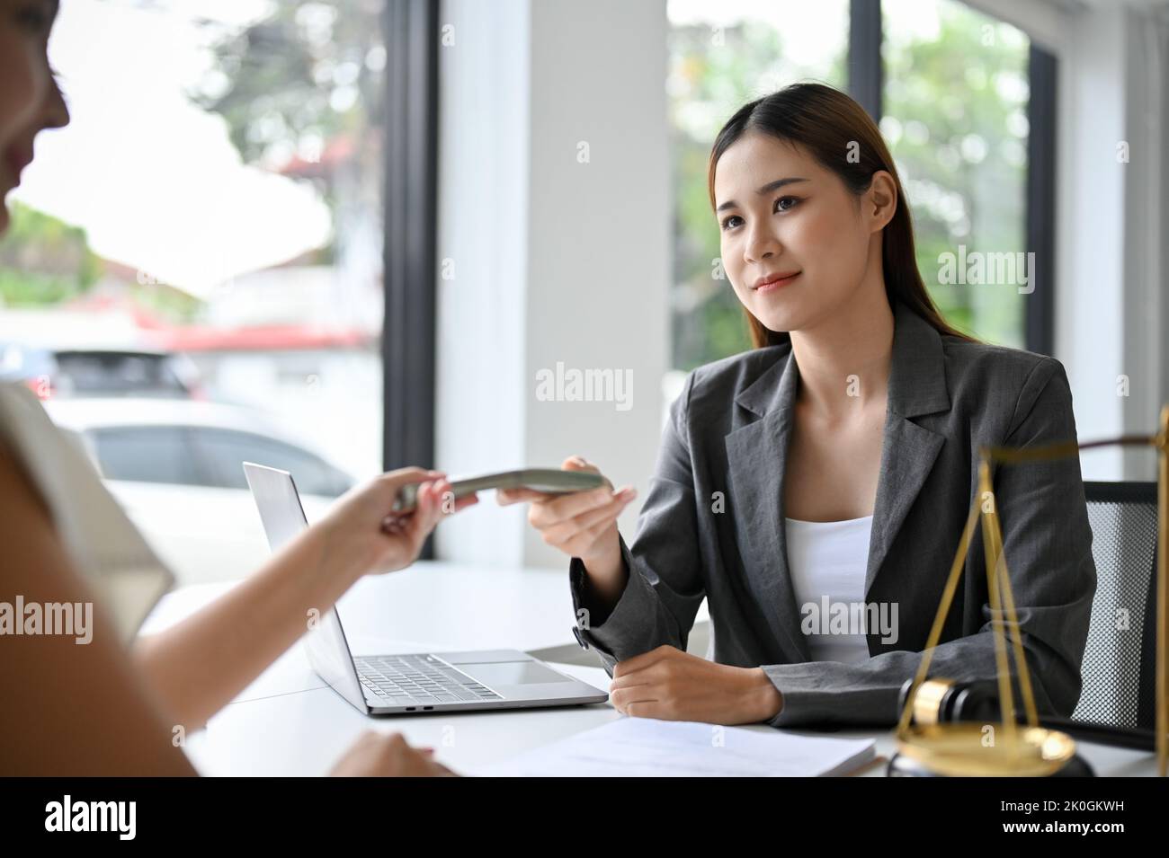 Woman receiving money office hi-res stock photography and images - Alamy