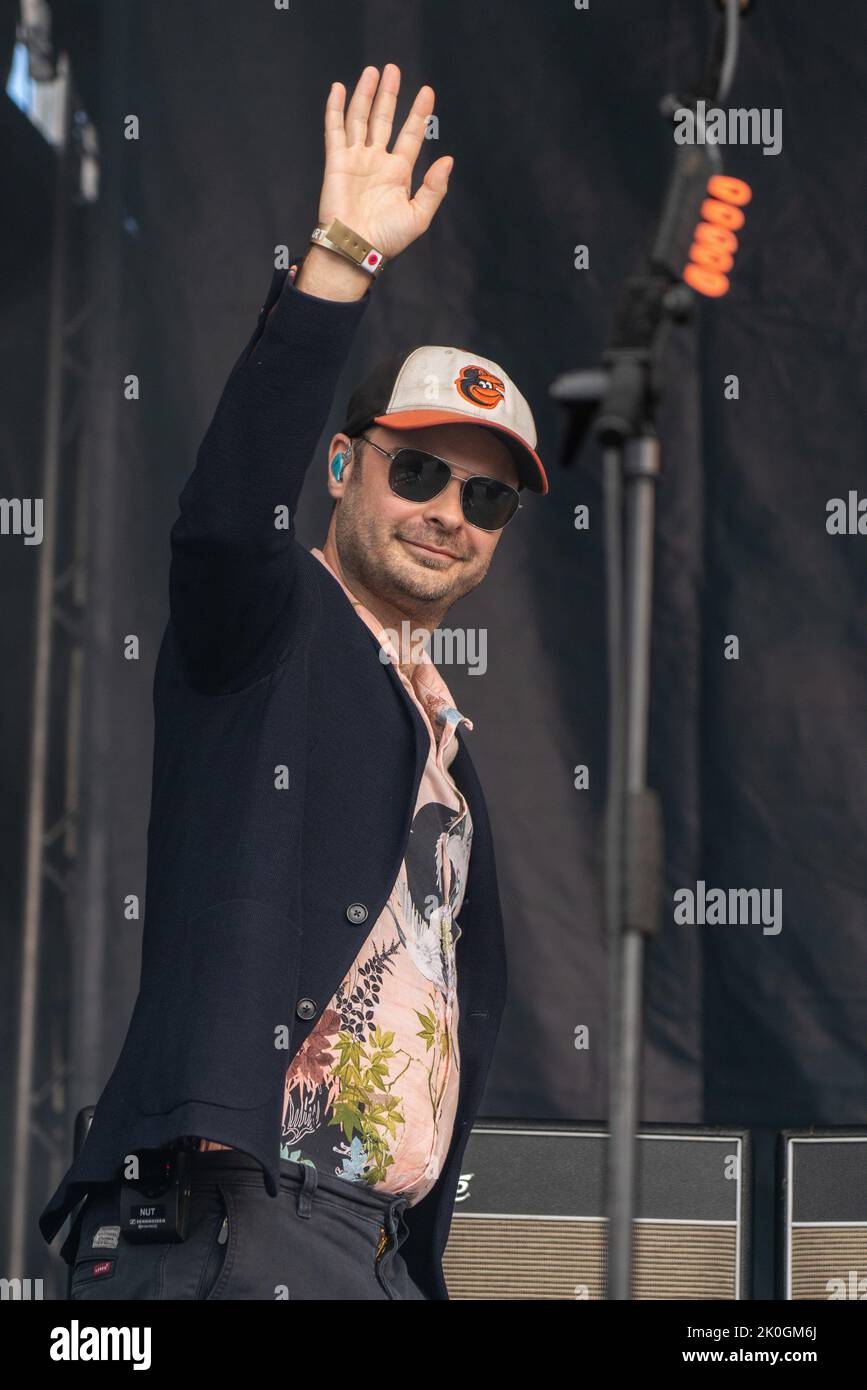 Kaiser Chiefs band member Nick 'peanut' Baines waves to the crowd while ...