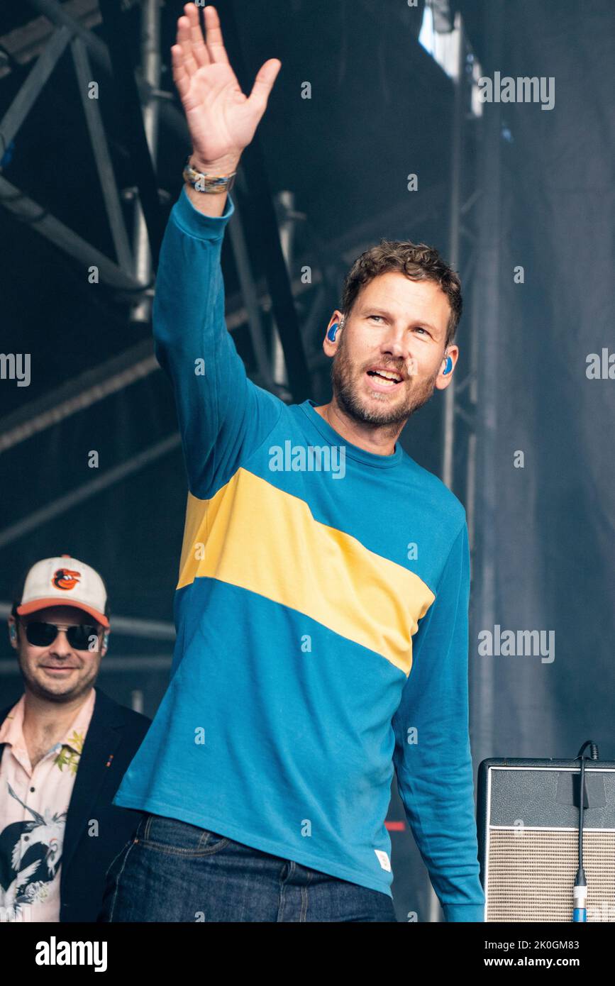Simon Rix waves to the crowd while performing live with Kaiser Chiefs ...