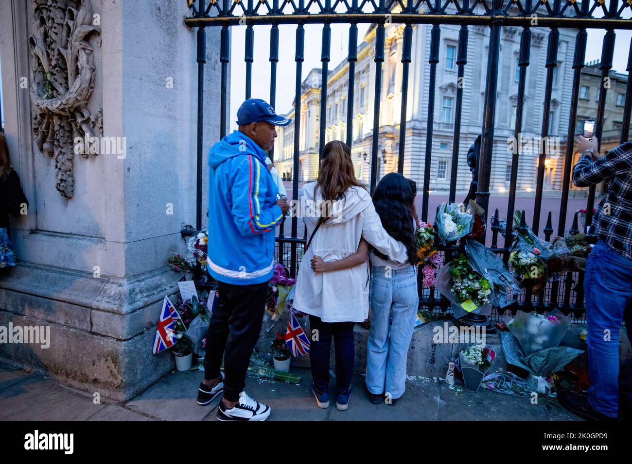 London, UK. 11th Sep, 2022. A family seen hugging each other outside ...
