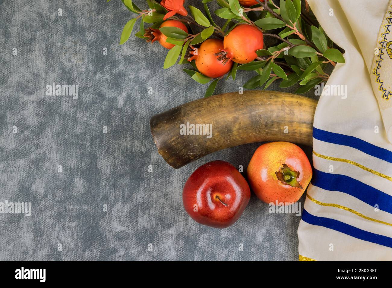 Symbols of the Jewish New Year with a shofar, honey jar, fresh apples ...