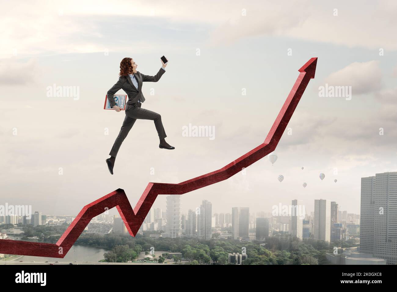 Businesswoman climbing on graph hi-res stock photography and images - Alamy