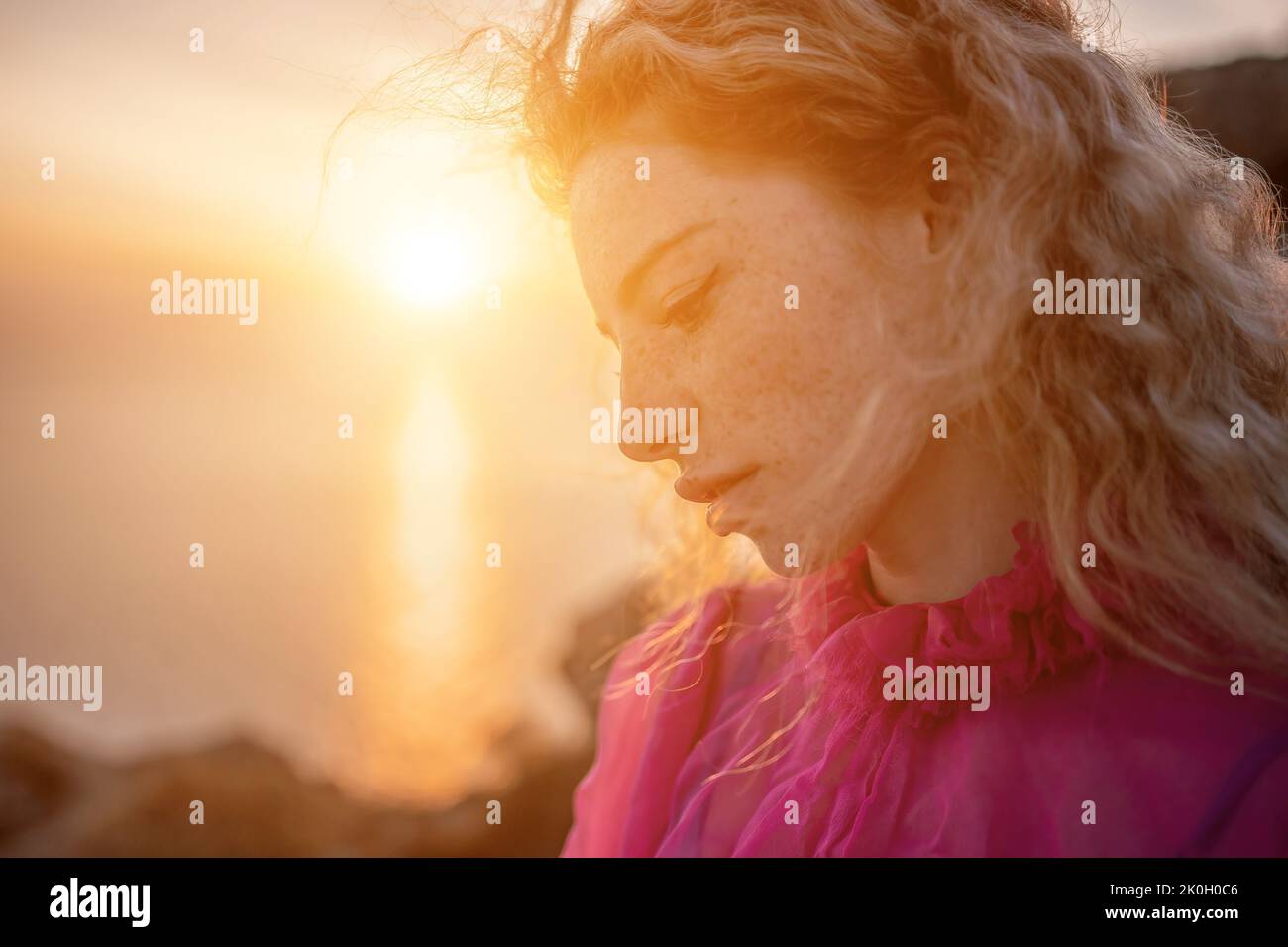 Close up portrait of curly redhead young caucasian woman with freckles ...