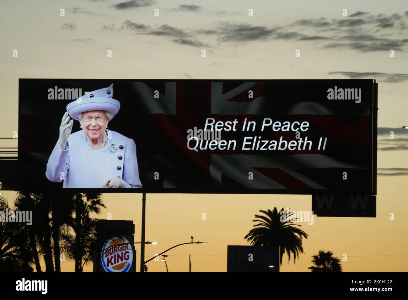 A billboard honoring Queen Elizabeth II with the words "Rest in Peace ...