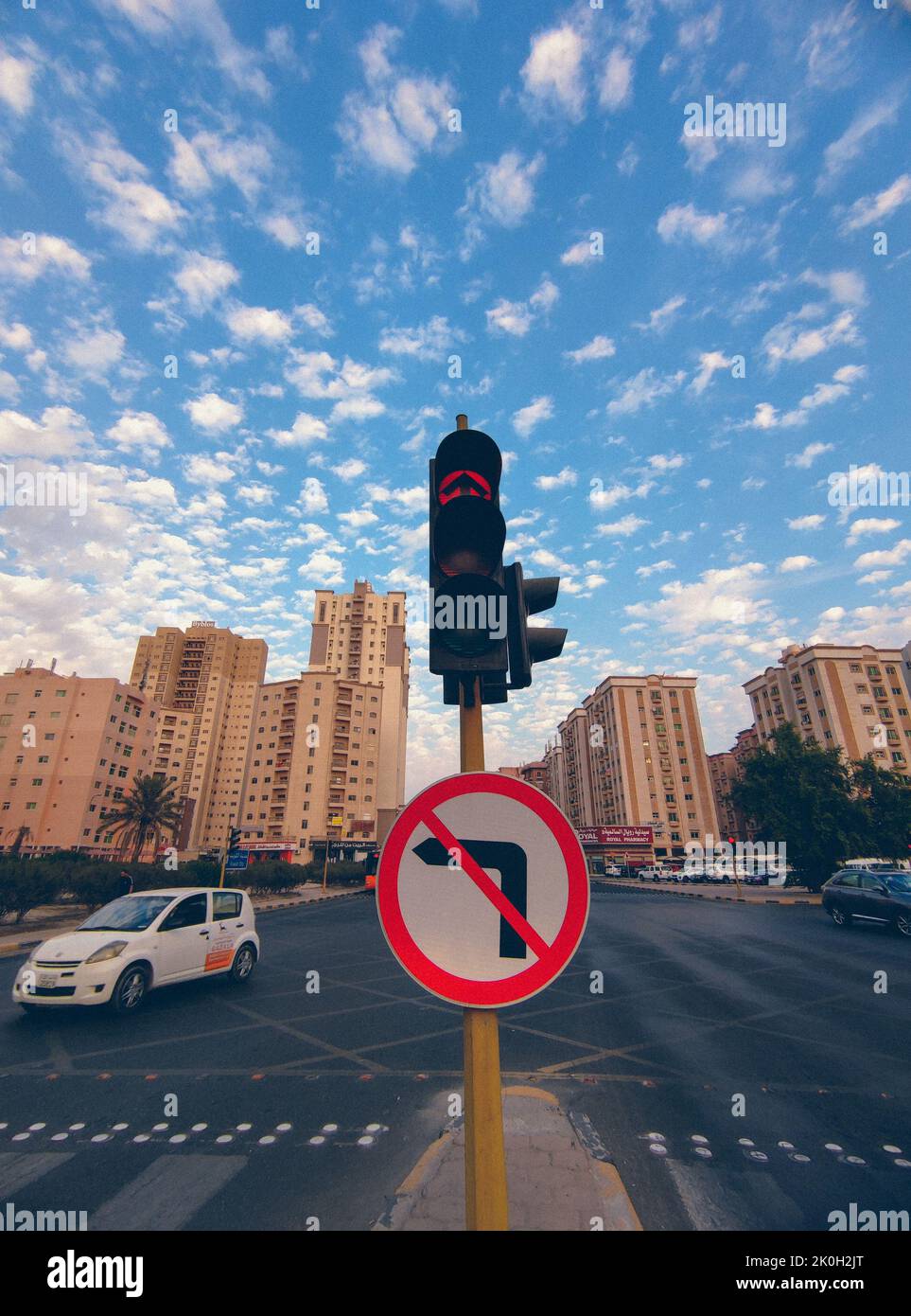 Red traffic light with no left turn sign Stock Photo - Alamy