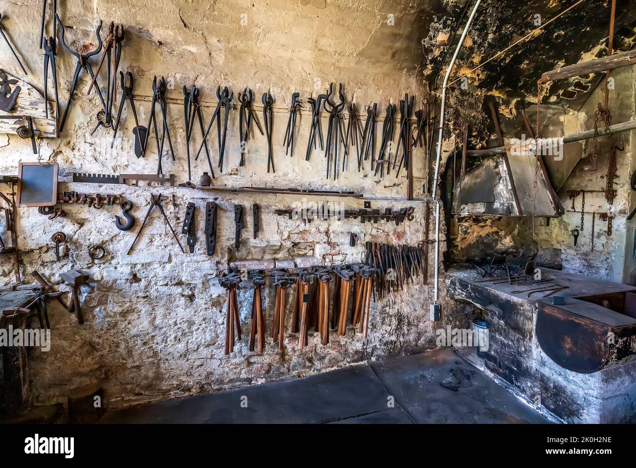 old forge with many instruments on the wall Stock Photo - Alamy