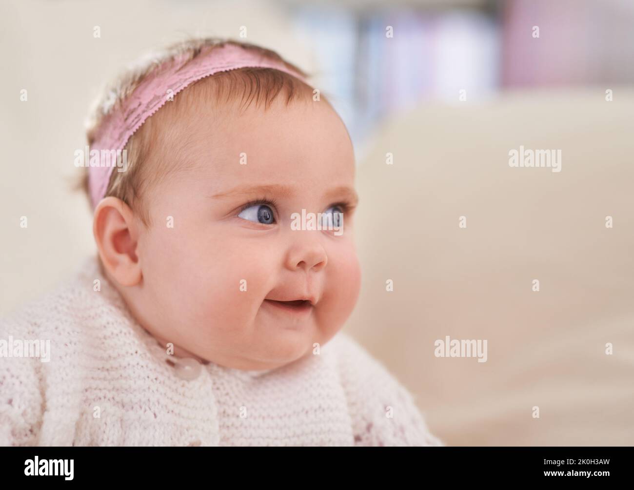 Shes such a curious little one. an adorable baby girl looking to the ...
