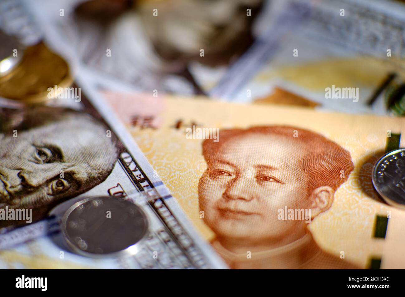 Chinese yuan money and US dollars, close-up. Dollar bills and yuan from China Stock Photo - Alamy
