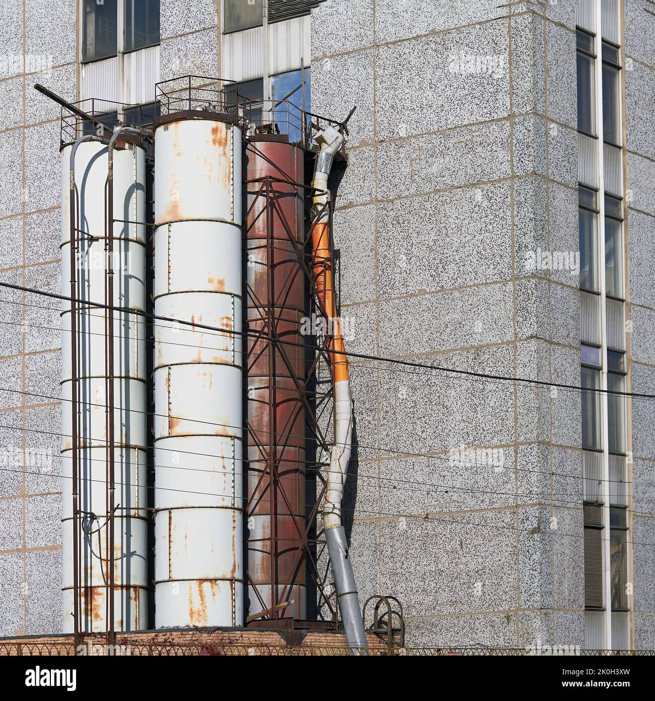 Industrial industrial pipes from the end of the building, rusty old ...