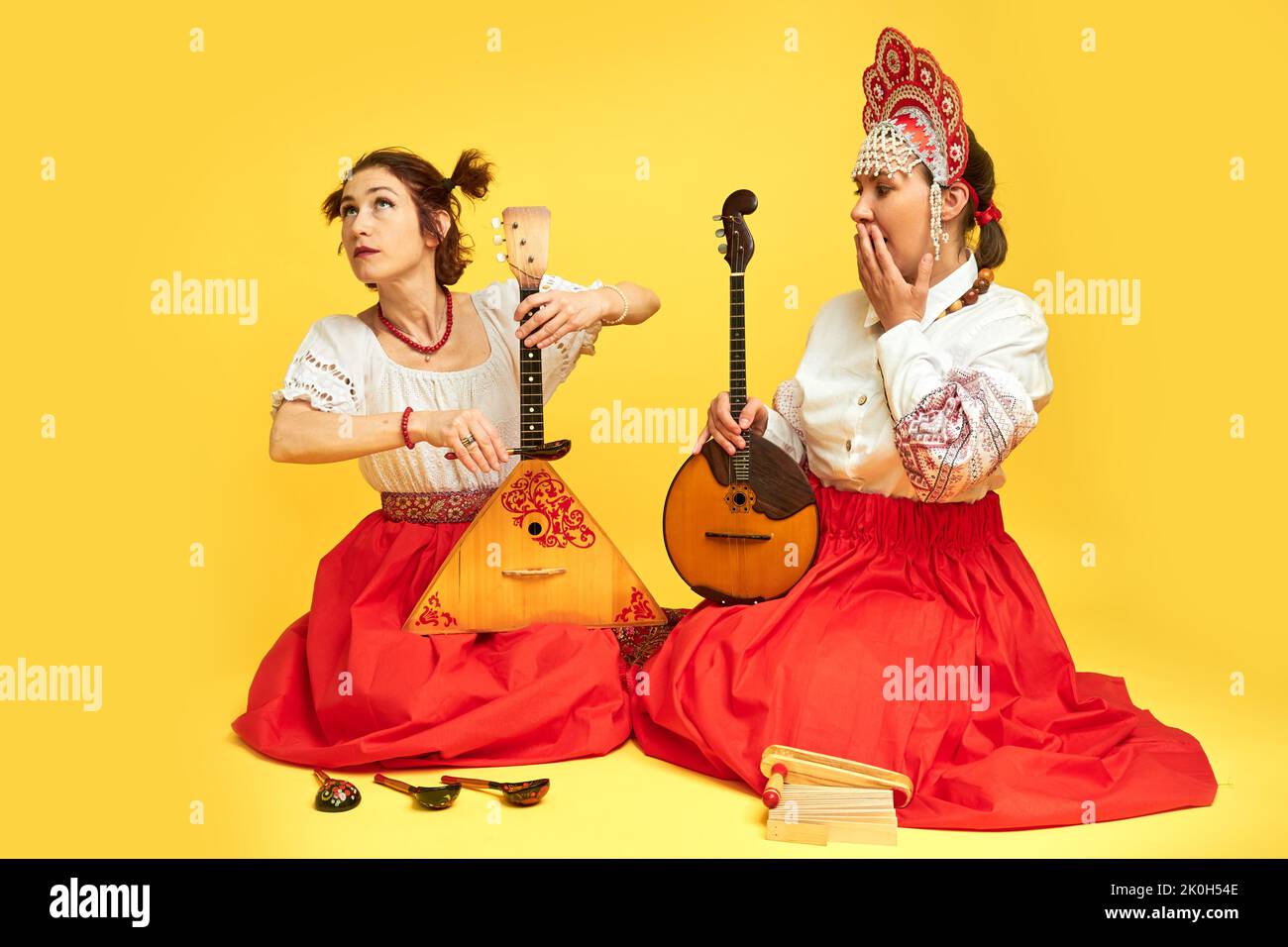 Women musicians in Russian folk dresses with musical instruments on a ...