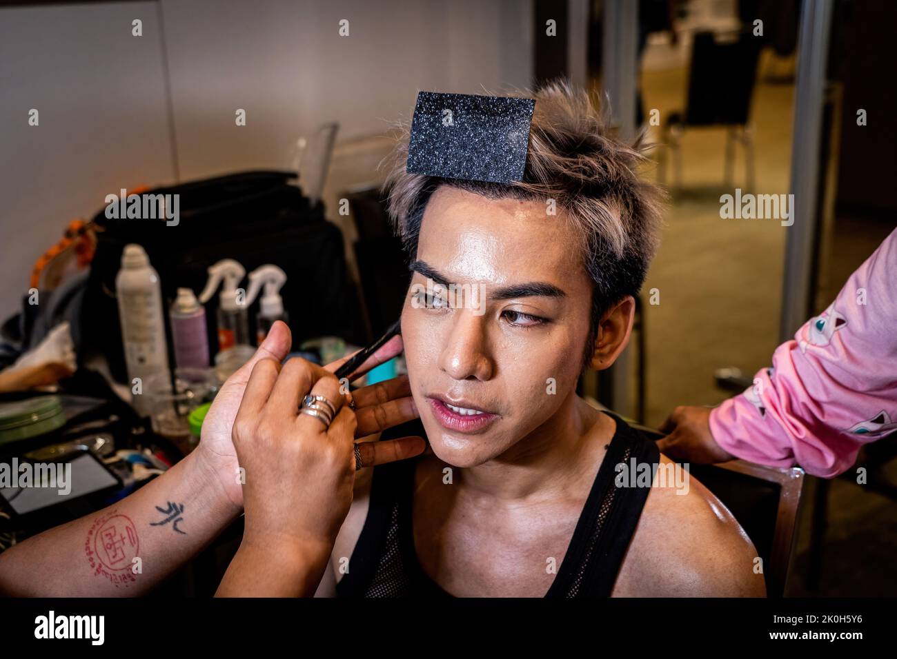Bangkok, Thailand. 12th Sep, 2022. LGBTQ Thai singer Ton Thanasit gets ready backstage before ...