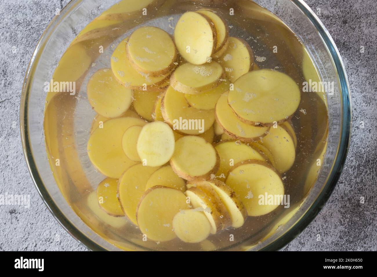 Sliced potatoes soaking in hi-res stock photography and images - Alamy