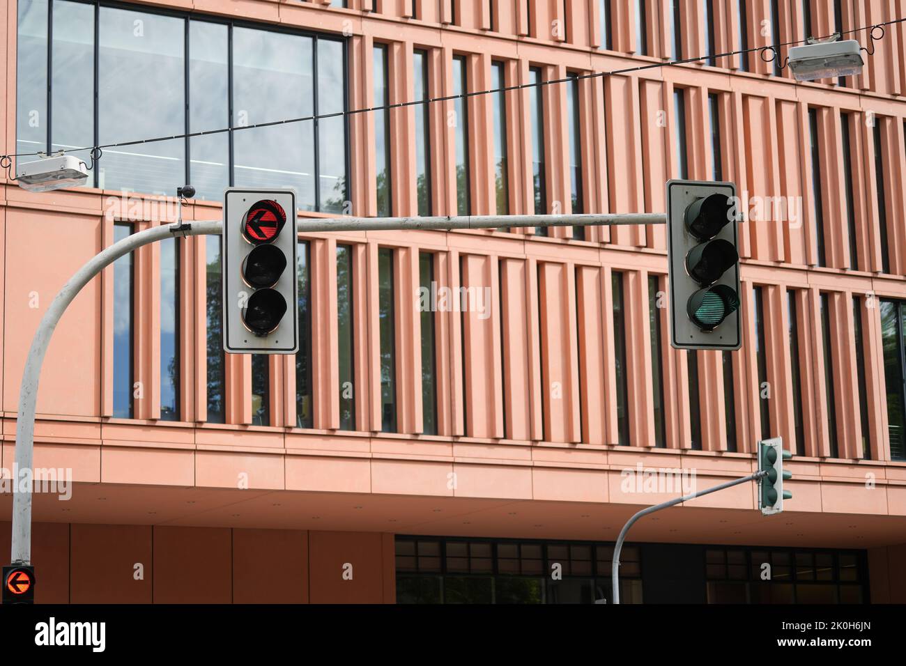 Traffic light with two red lights and a green light hi-res stock ...