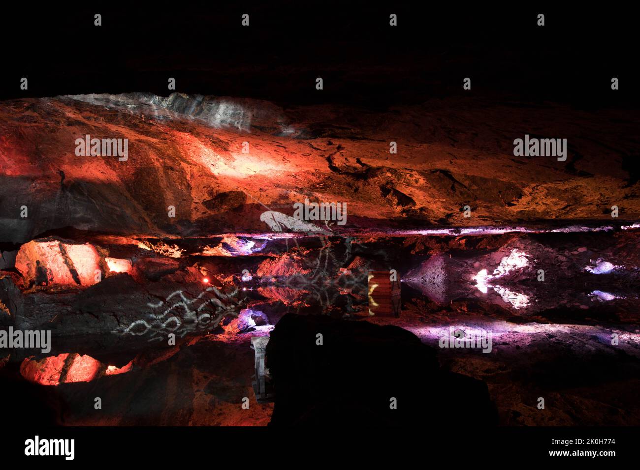 A beautiful view of a cave with lightning at night Stock Photo - Alamy