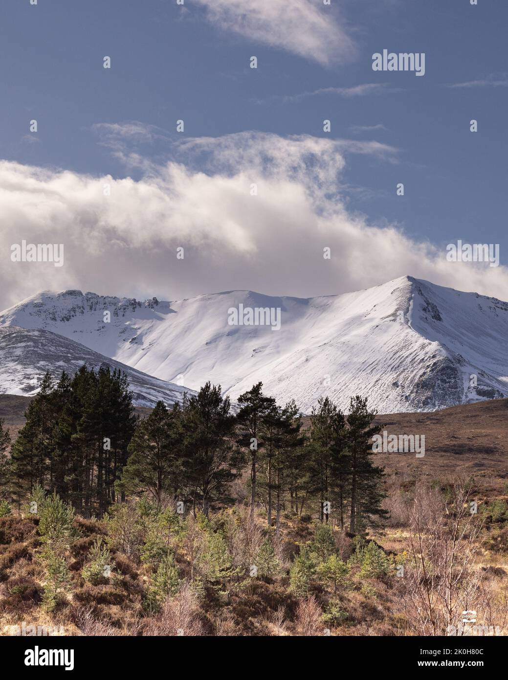 A vertical shot of the snowy mountains in Scottish Highlands Stock ...