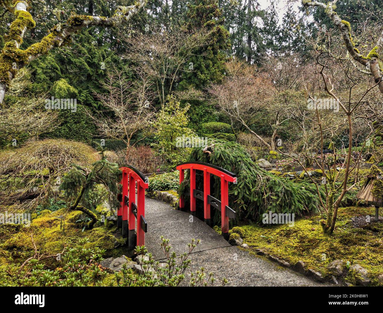 A beautiful walkway, bridge, and garden landscape in a park Stock Photo ...