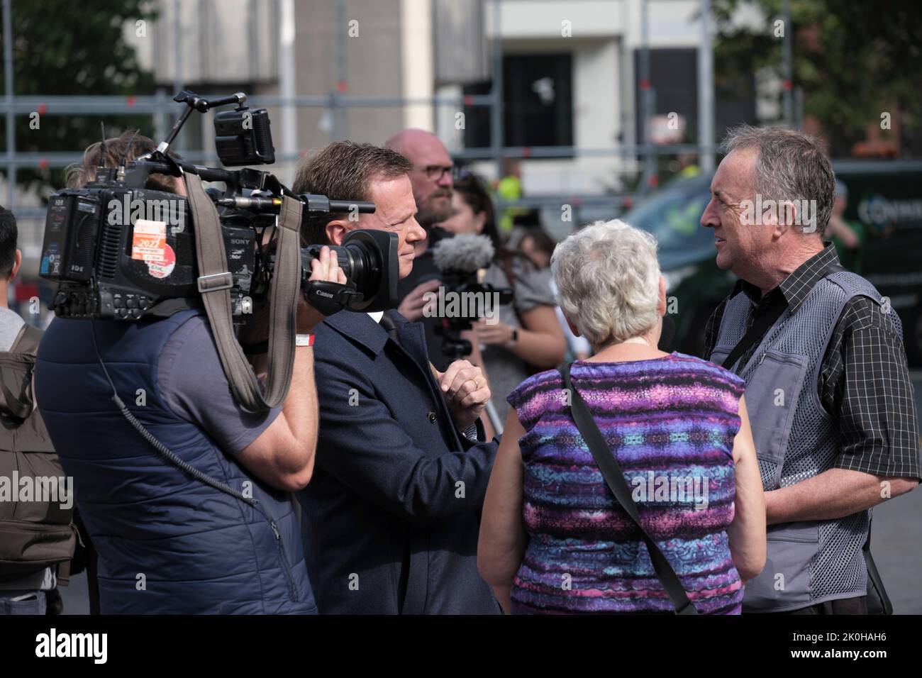 Journalist interviews people outside Westminster Abbey prior to Queen Elizabeth funeral. 11th ...