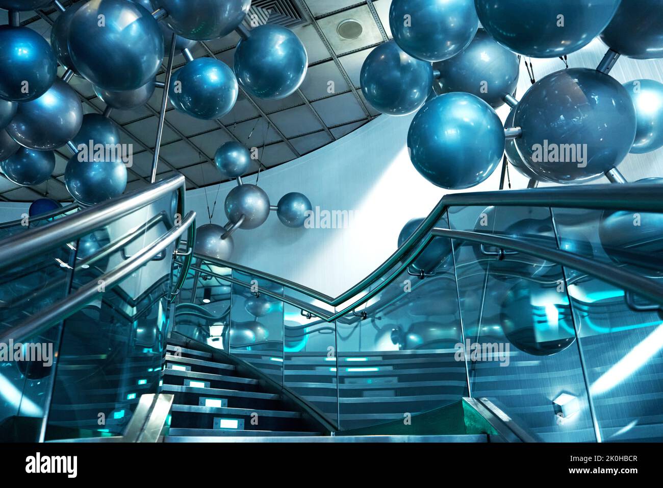 Installation of stylish connected silver balls decoration modern ...