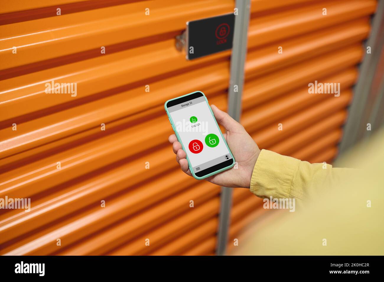 Authorized worker opening the warehouse digital lock with his ...