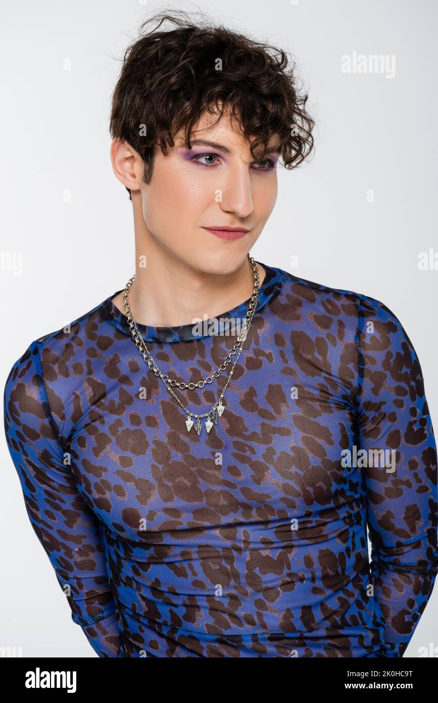 portrait of brunette nonbinary model in stylish long sleeve shirt and ...