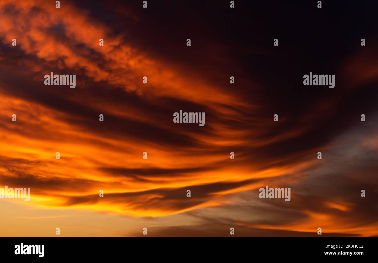 Abstract clouds with vibrant color at sunset, curve pattern and ...