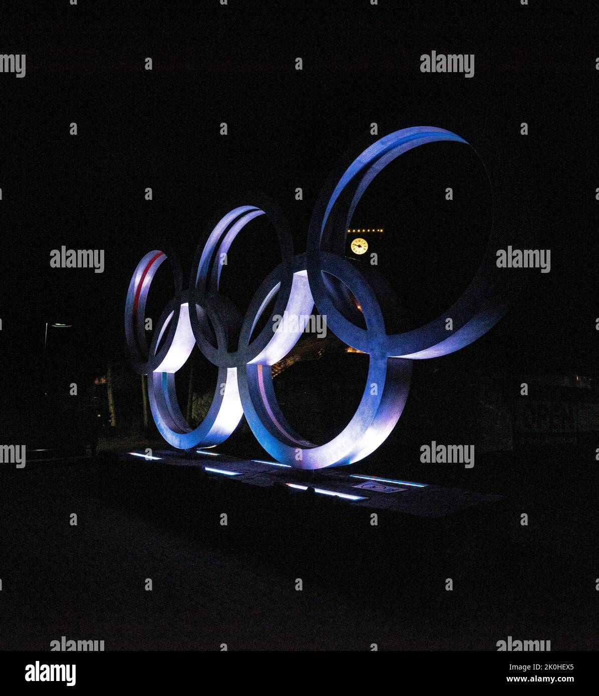 An Olympic rings with lights during night time Stock Photo - Alamy