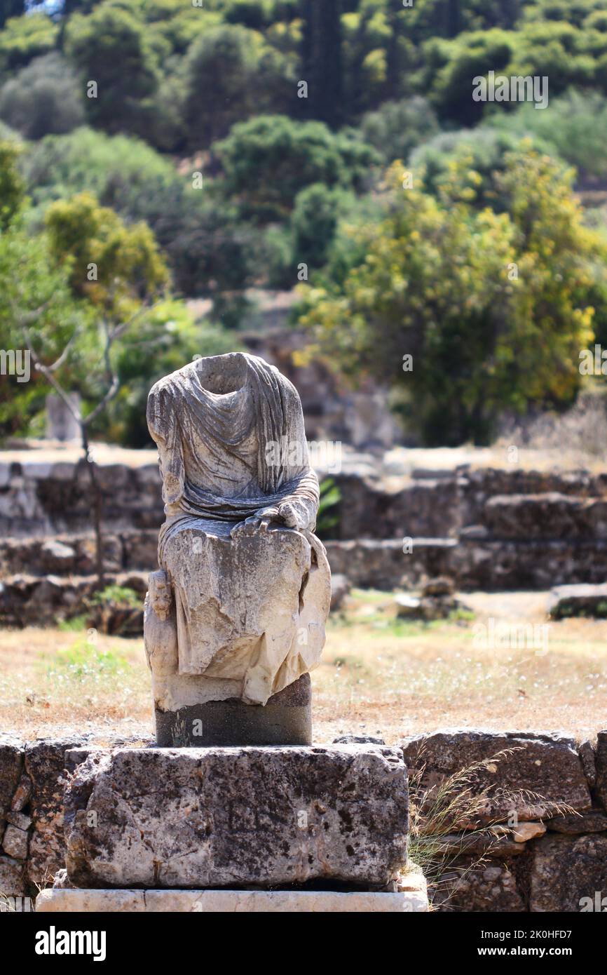 A vertical shot of a headless statue in the Palace of the Giants ...